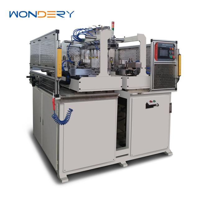 Close-up of radiator clinching machine components