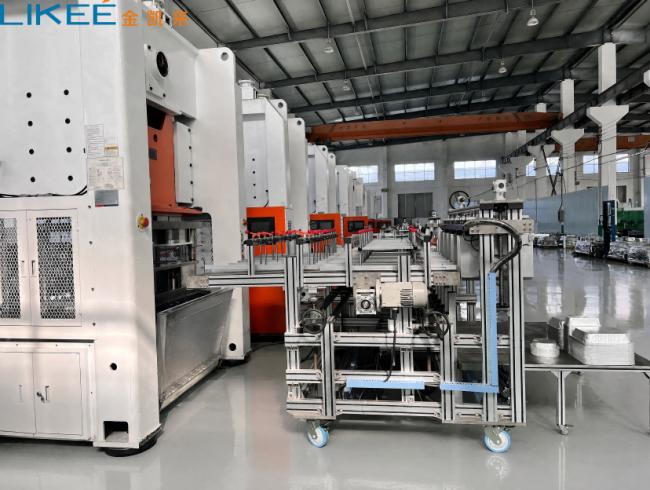Close-up of the foil container press working area