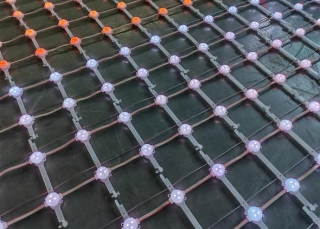 LED Mesh Display in operation showing vibrant RGB colors