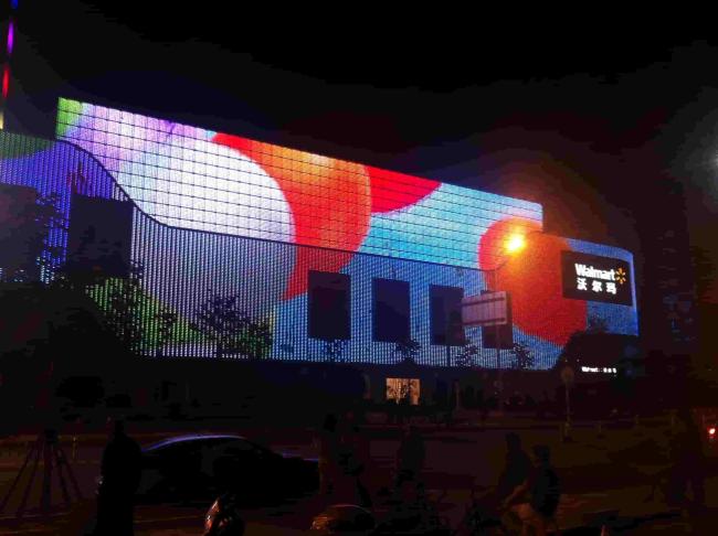 Flexible LED Mesh Screen installed on curved architectural surface