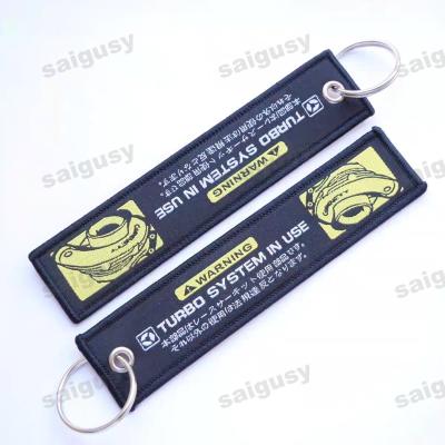 중국 자수 디자인 블랙 골드 카 컬처 키 링, 메탈릭 톤 및 대비 스티칭 디자인, 맞춤형 로고 환영 판매용
