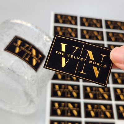 China High Quality Customized Embossed UV Gold Foil Printing Card Press Gold Art Paper Velvet Gold Stamping Label Sticker for Perfume & Party for sale