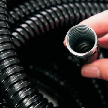 Flexible metal conduit with plastic coating showing corrugated structure