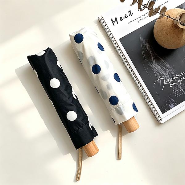 Two compact polka dot ladies travel umbrellas side by side, solid wood handle with wrist strap lightweight 300g parasol