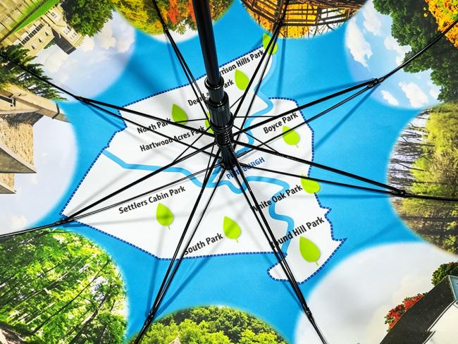 Custom photo-printed umbrella displaying detailed inner canopy printing
