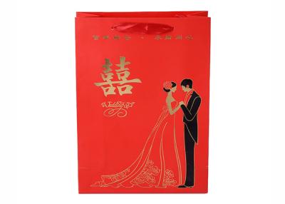 Cina Borse del regalo della carta di logo della stagnola di oro con la maniglia del nastro per nozze in vendita