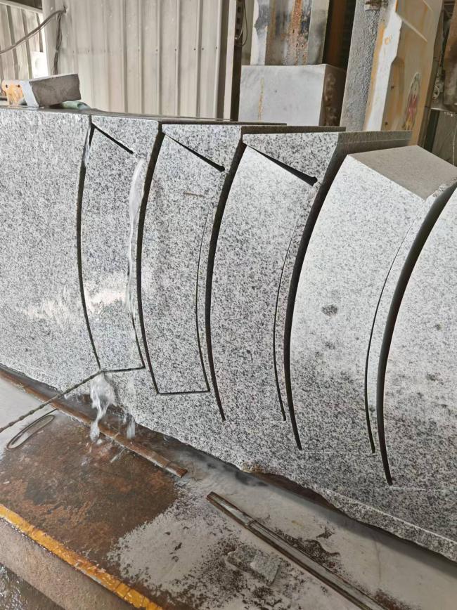Operational view showing curved curbstone cutting process