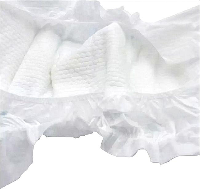 Close-up of diaper's breathable backsheet and elastic waistband
