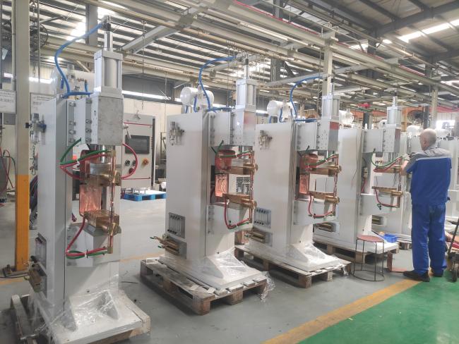 Pneumatic projection welding machine operating on shop floor