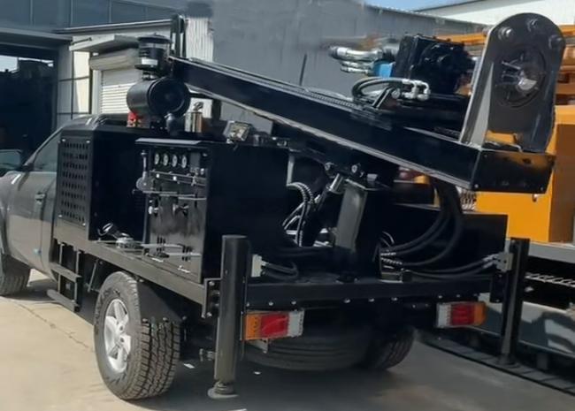 Dual Power Head Tractor Mounted Drilling Machine in operation