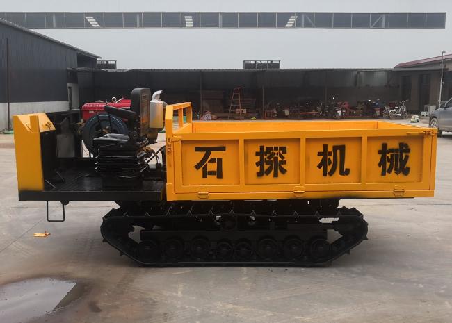 Close-up of rubber track system and undercarriage