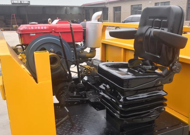 Rubber track dumper side view showing compact design