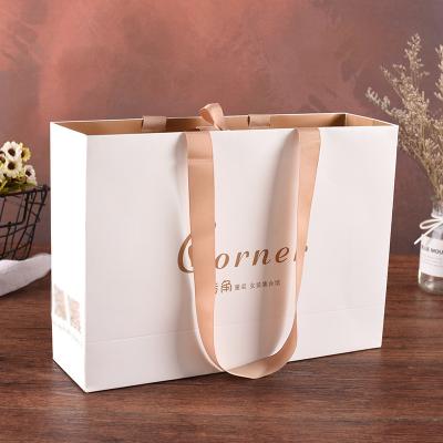 China Creatrust Customized Handle Kraft Small Jewelry Survenier Golden Printed Panama Tyvek Grocery Paper Bag for sale