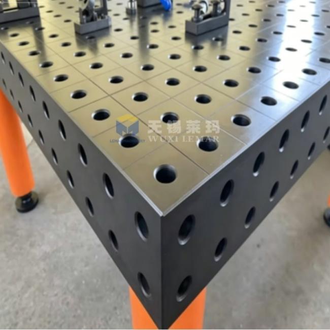 Welding table in use with various fixtures and clamps