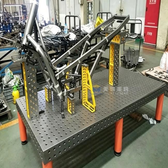 Close-up view of D16 welding table grid and construction
