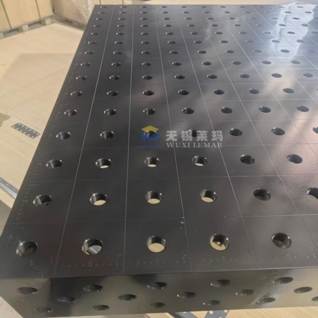 Close-up of welding table surface and holes