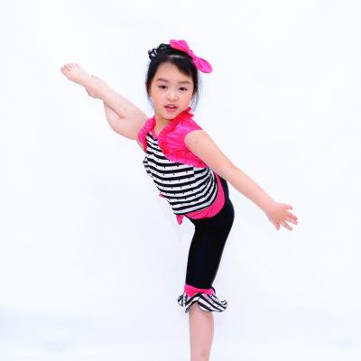 Cina Vestiti bianchi neri di ballo dei bambini delle strisce di N con gli archi neri della disposizione della ciliegia della vita di Ruflle dei cristalli di rocca in vendita
