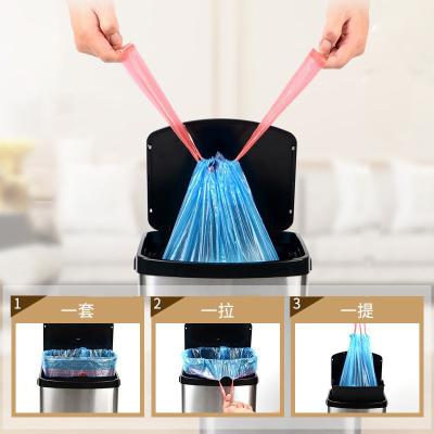 China Saco de basura portátil de cuerda de tira para el hogar con diseño colorido para una gestión fácil de los residuos en venta
