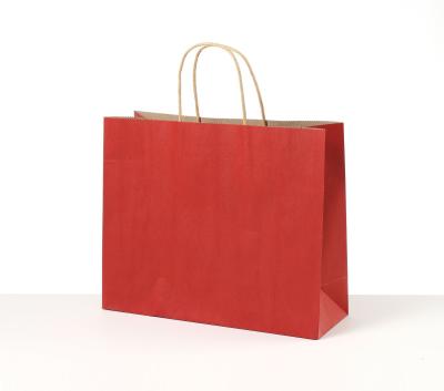 Cina Rosa di lusso dei sacchi di carta di Kraft del regalo che imballa logo su ordinazione stampato per le scarpe dell'abbigliamento in vendita