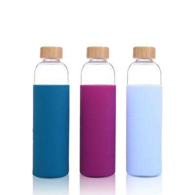 Chine résistance thermique inodore de couvercle en bambou en verre portatif de la bouteille d'eau 500ml à vendre
