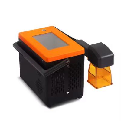 China Metal Marking Made Easy 30W/50W Power Portable Fiber Laser Marking Machine with Smart Handheld Galvo Ezcad Control System for sale