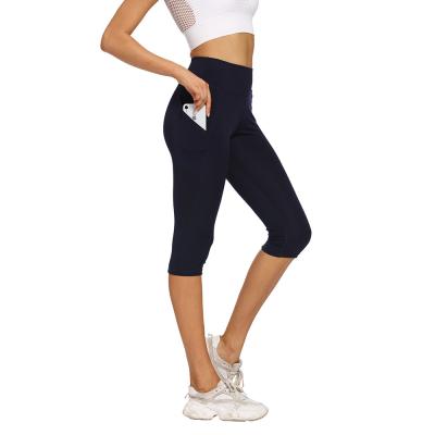 Cina I pantaloni di yoga dei blu navy mettono le ghette in cortocircuito della palestra di lunghezza per le donne con le tasche in vendita