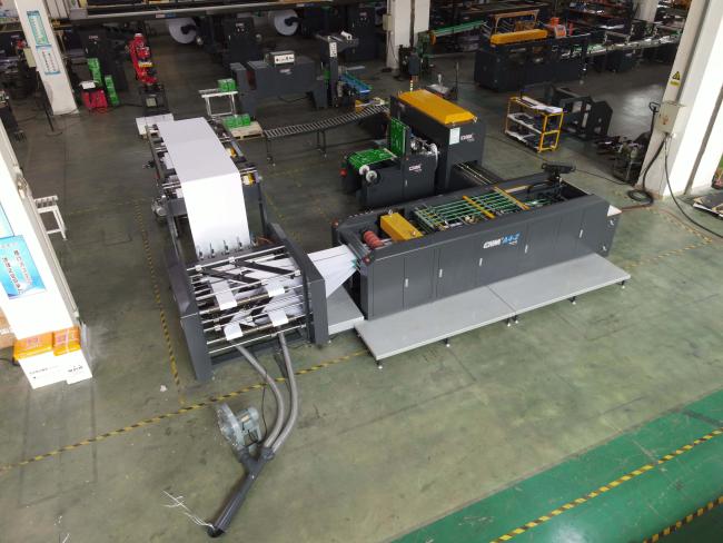 Automated packaging section showing servo-controlled mechanisms