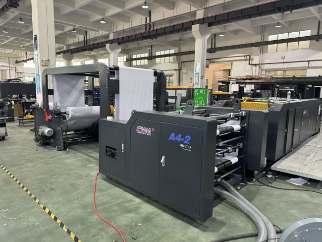 Close-up of paper cutting mechanism with rotary knives