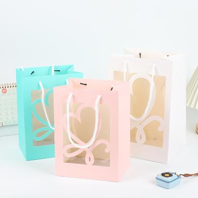 China Transparent Hand-Held Gift Bag Doll Hand-Held Bag Holiday Return Gift Gift Packaging Bag for sale