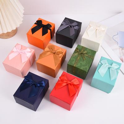 China Creative World Cover Gift Box Square Ribbon Watch Packaging Box for sale