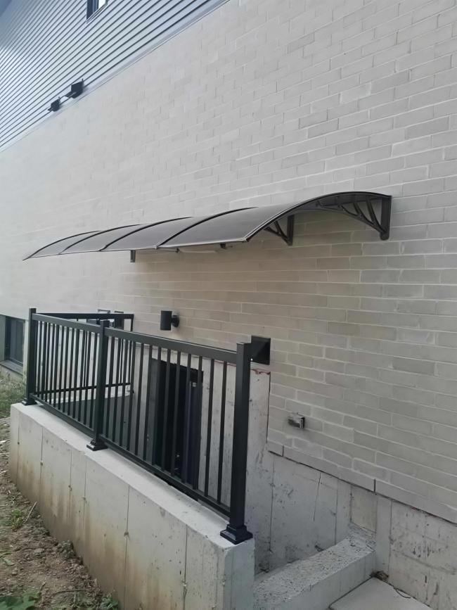 Split panel polycarbonate awning showing installation process