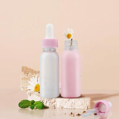 China Customize 30ml 1oz Plastic Pink White Cleaning PET Round Serum Dropper Bottle For Body Skin Care for sale