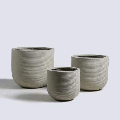 China Texture Surface GRC Flower Planters Round Shape For Stunning Plant Displays for sale