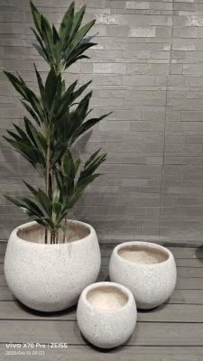 neutral beige natural speckled stone -mimic design round fiber clay planter lightweight durable low-maintainence flower pot holiday Villa office decoration garden landscaping project