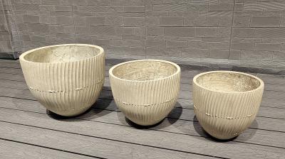 China Warm Natural Beige Rhythmic Tactile Pattern Round Fiber Clay Planter Home Porch Project for sale