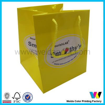 Cina Sacchetti della spesa di carta stampati grande giallo riciclati per l'imballaggio del bigné in vendita