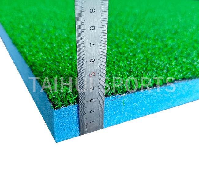 Artificial turf safety mat in playground setting