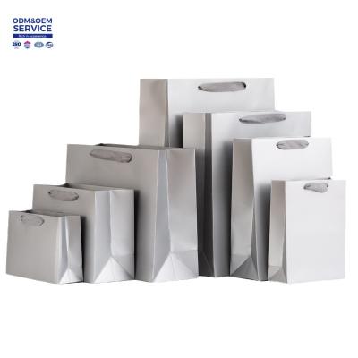 China Luxury Custom Paper Bags With Your Own logo Shopping Packaging Brown Kraft Gift Craft Clothes Carrier Paper Bag With Handles for sale
