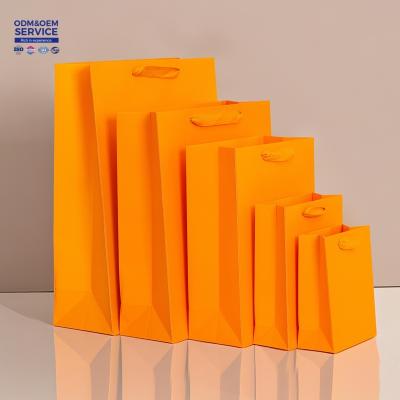 China Hot Sale Manufacturers Recyclable Kraft Paper Handle Bag square Bottom Shopping Gift Bag Packaging Paper Bags with Handles for sale