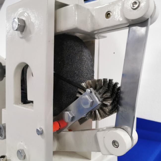 UP-1008 Akron abrasion tester grinding wheel and cleaning wire brush close-up