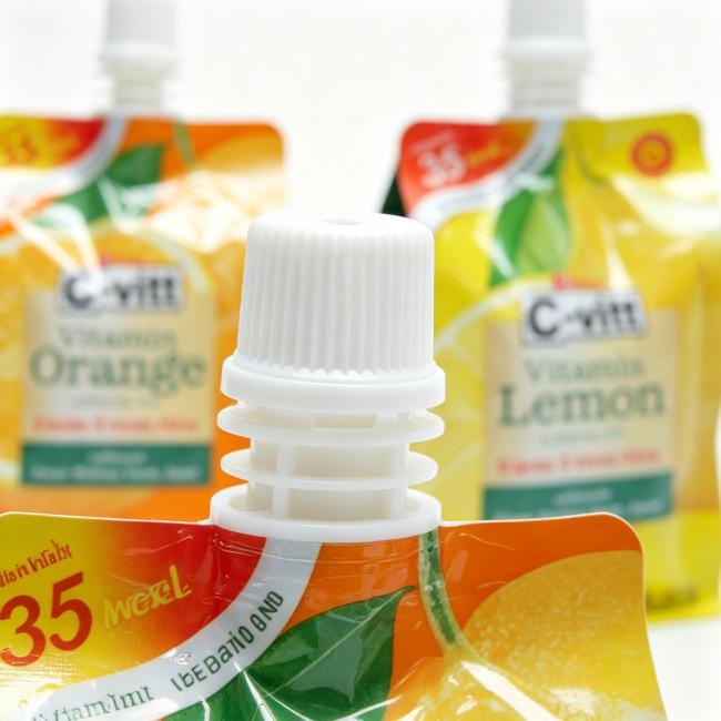 Leak-proof white plastic spout cap detail of fruit juice spout pouch