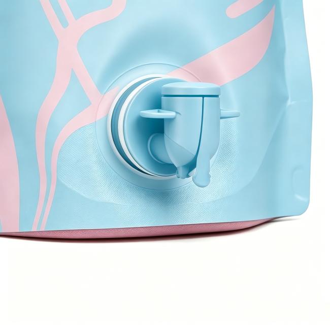 Macro close-up of the pouch’s flip pour tap assembly. Shows food-grade light blue plastic tap body, double-layer silicone sealing grommet, anti-spill flip lock structure, highlighting the leakproof sealing technology for liquid wine and cold drinks.