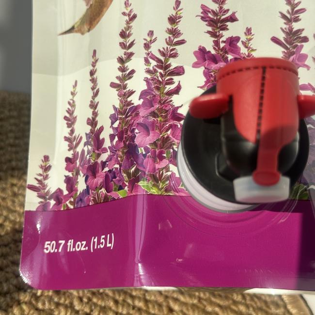 1.5L volume marking close‑up on custom printed hummingbird nectar feeder spout pouch`