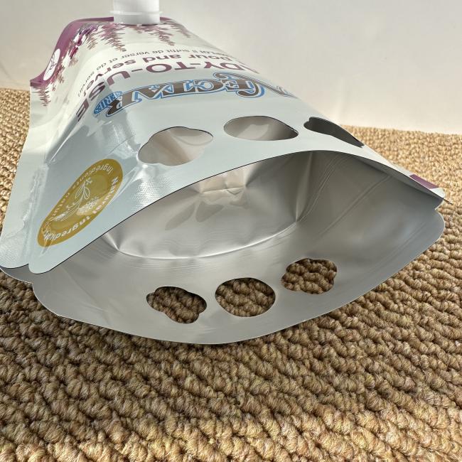 Multi die‑cut carry handle holes, aluminum foil barrier inner layer for liquid hummingbird nectar pouch`
