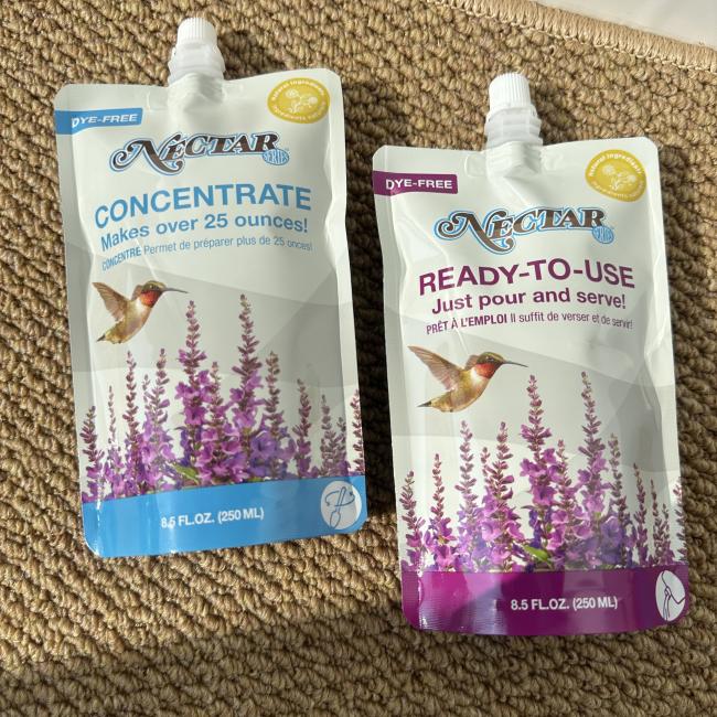 Resealable screw cap stand‑up spout bag for wildlife liquid feed
