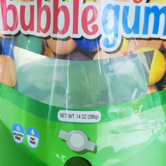 Clear window showing colorful candy inside a stand-up pouch