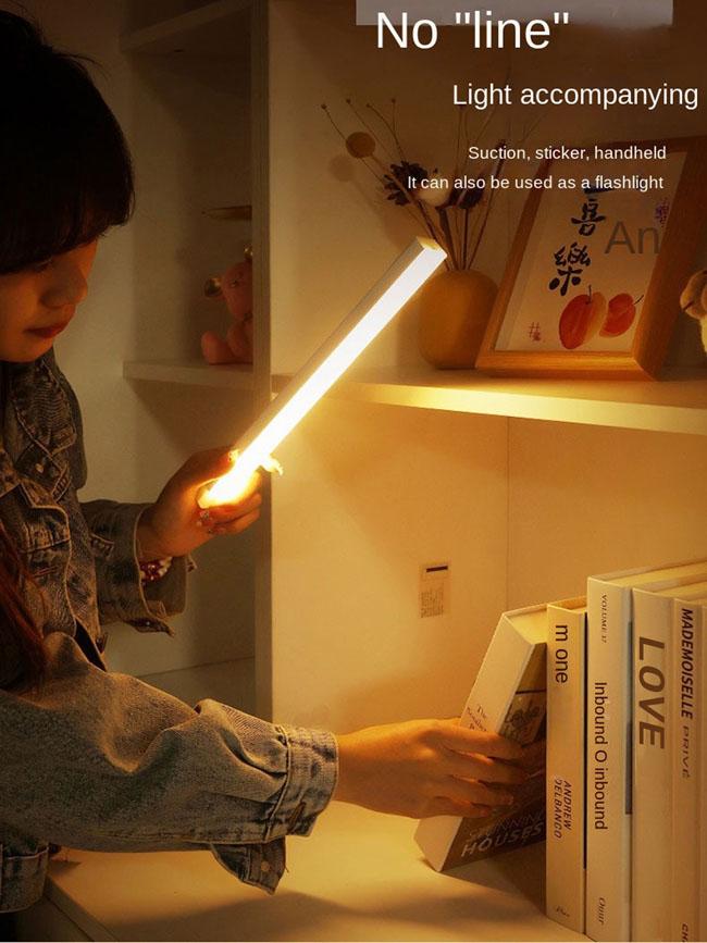 Motion sensor light illuminating dark staircase