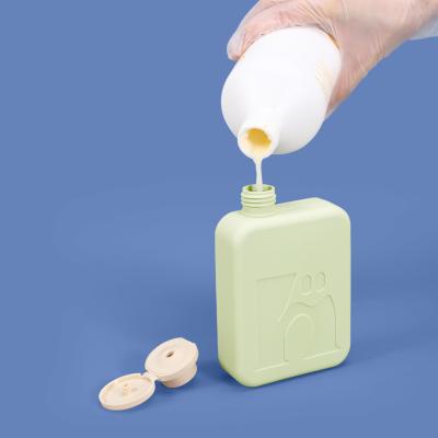 Cina Flacone quadrato in plastica verde da 300 ml per shampoo e balsamo, flacone cosmetico in plastica personalizzato con tappo a ribalta in vendita