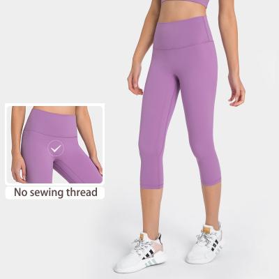 Cina 10 ghette atletiche nude di nylon di sollevamento dei pantaloni di sport di yoga della tasca dell'alta anca della vita di colori in vendita