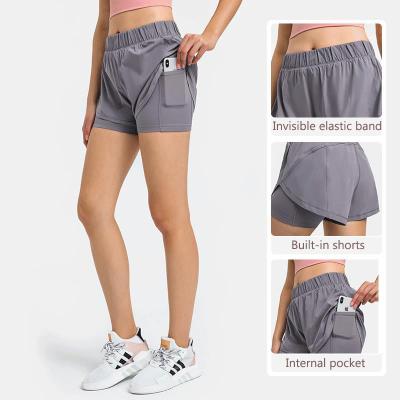 Cina La tasca elastica all'altezza della vita regolabile di yoga mette i pantaloni in cortocircuito che anabbaglianti di sport l'accessorio mette in vendita